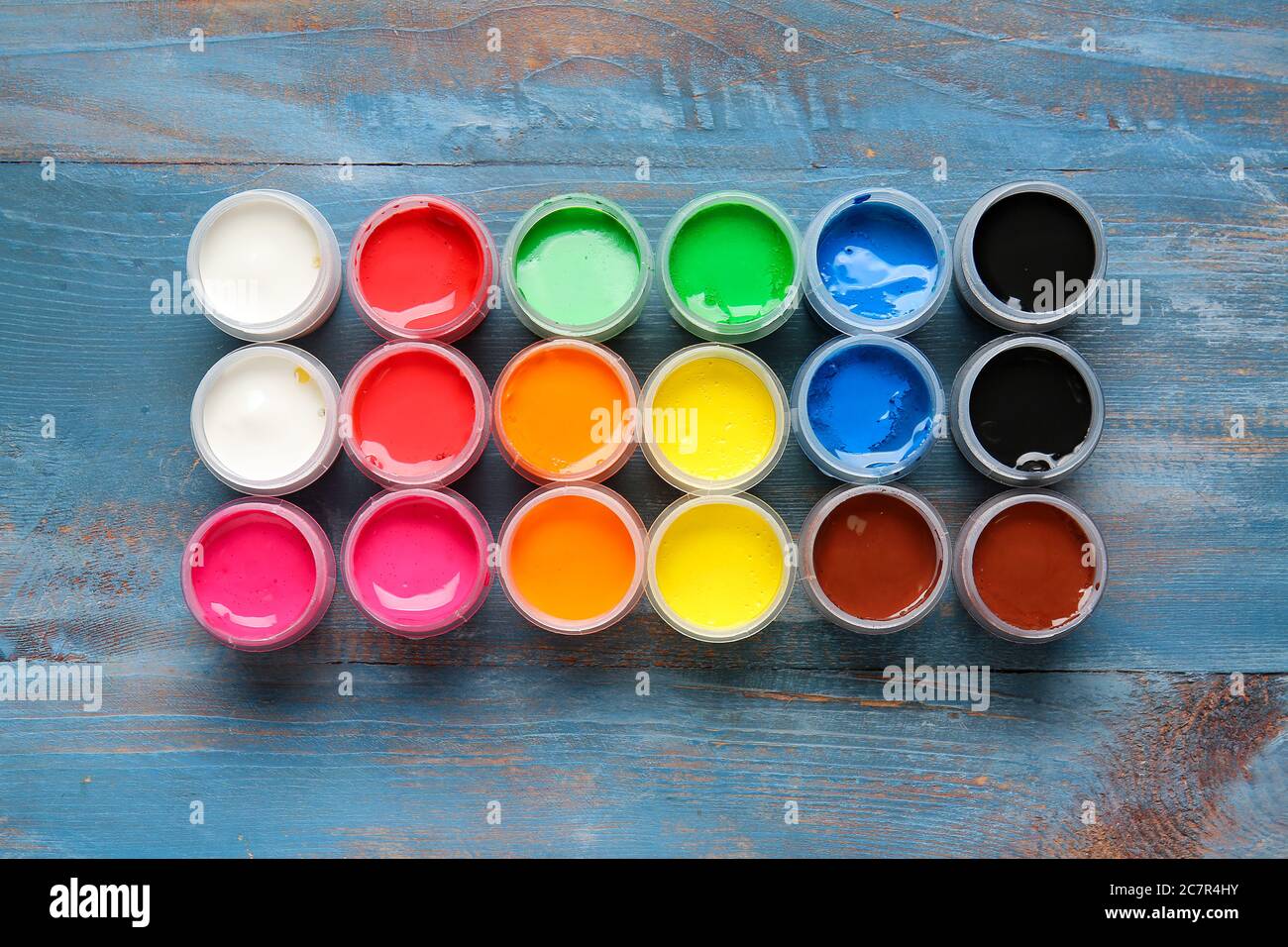 Bottles of gouache paints on table Stock Photo - Alamy