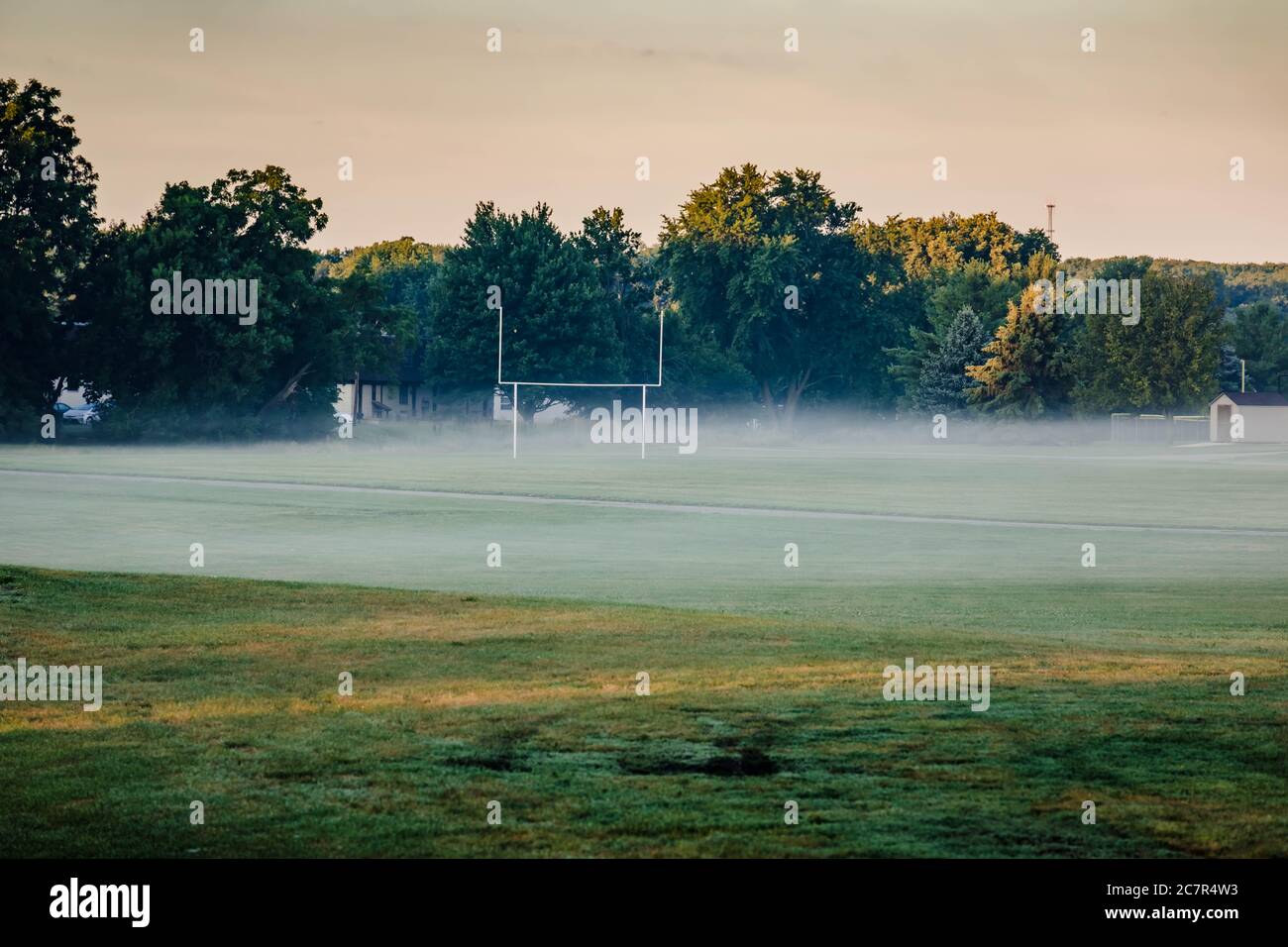 fog over the football field at the middle school at dawn Stock Photo ...