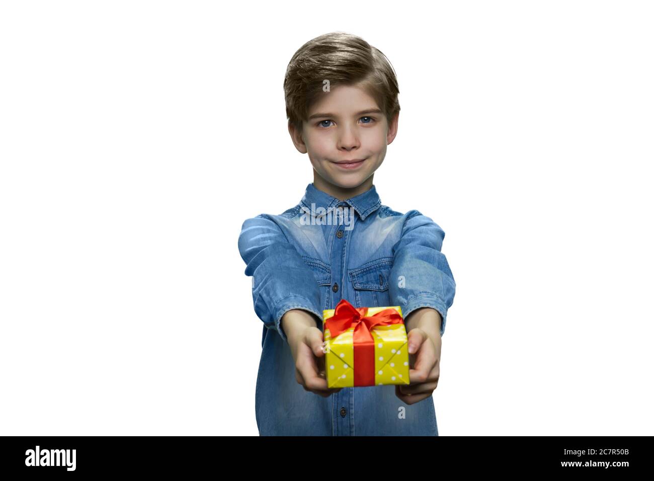 Smiling boy is giving small gift box Stock Photo - Alamy