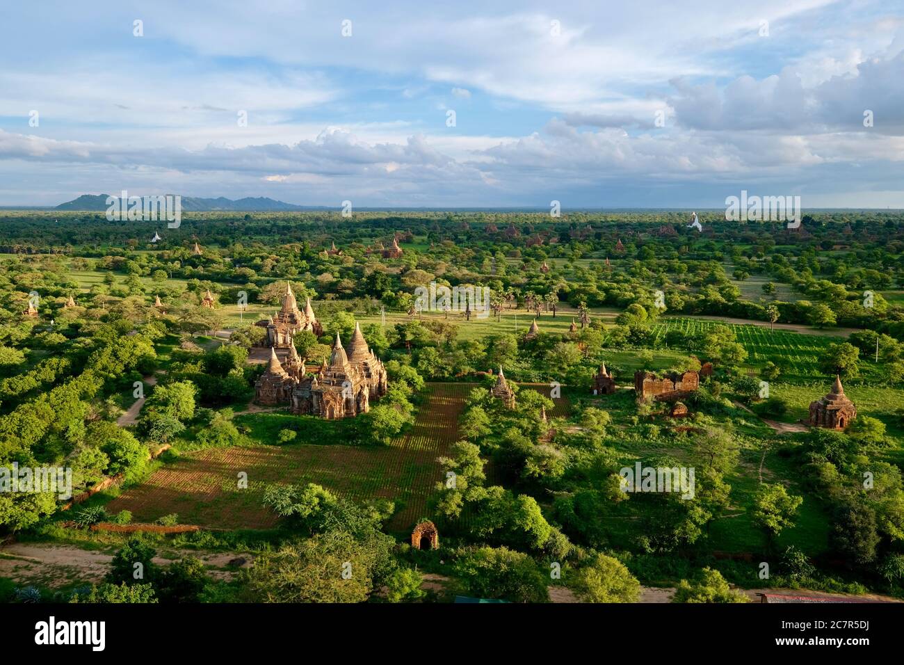 aerial view of sunset of Bagan Myanmar. Ancient pagoda in wide green ...