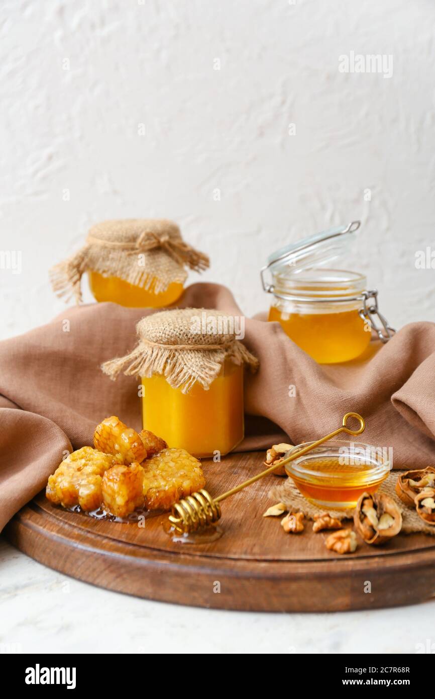 Composition with sweet honey on table Stock Photo - Alamy