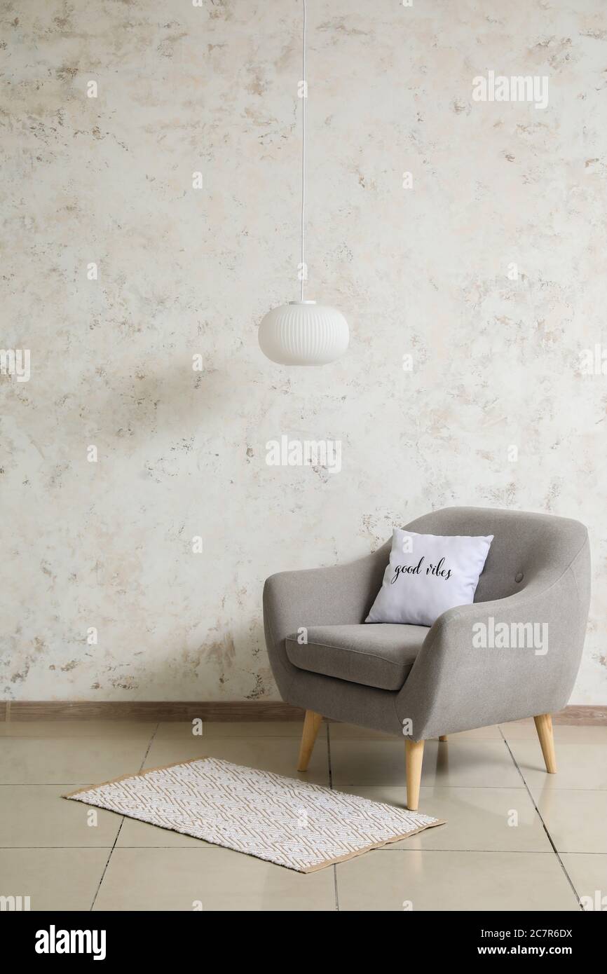 Interior of room with armchair and lamp Stock Photo - Alamy