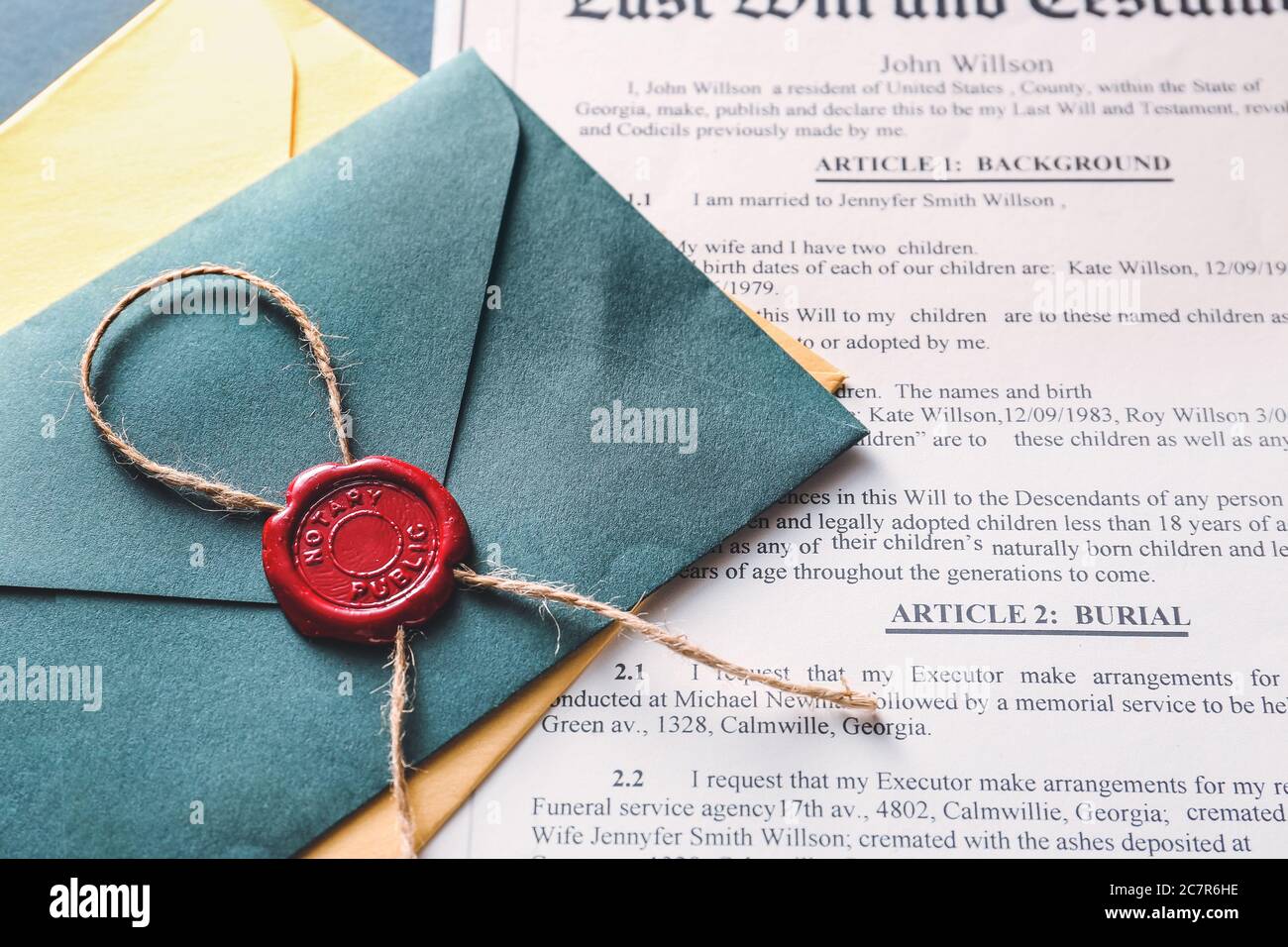 Envelope with notary public wax seal and document on table Stock Photo ...