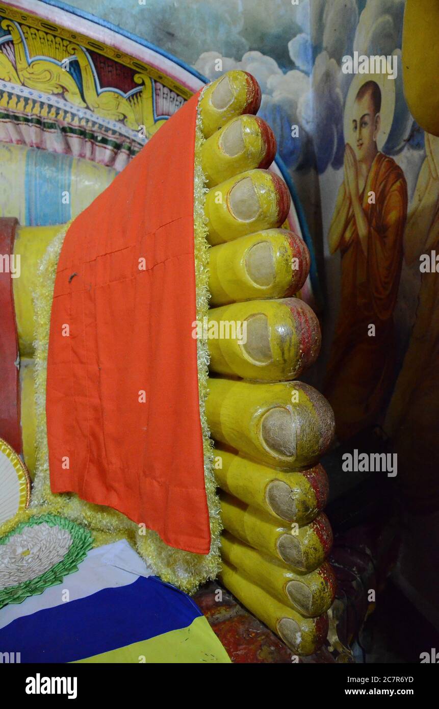 Vertical shot of the feet of a statue of a Hindu God Stock Photo - Alamy