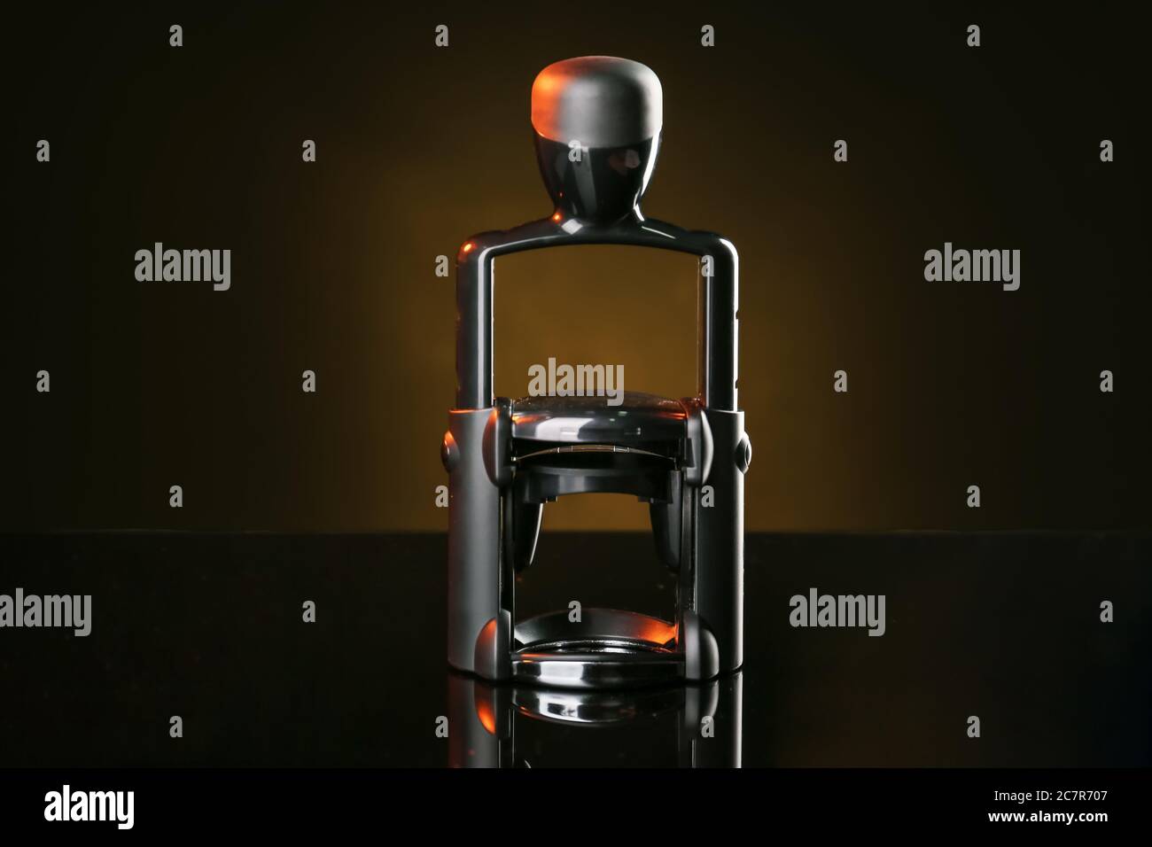 Black stamp on dark background Stock Photo - Alamy