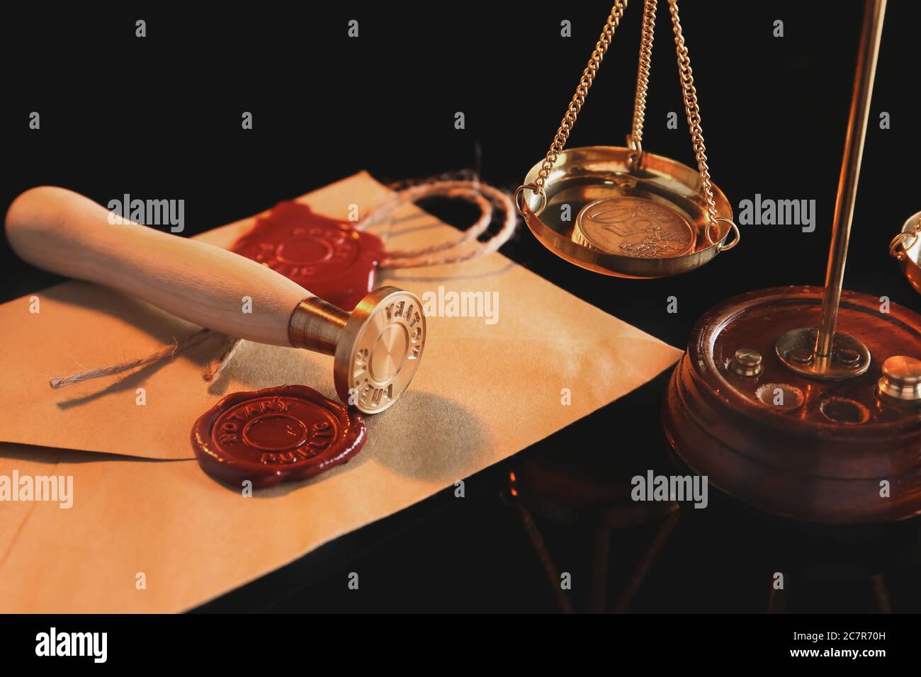 Scales of justice with envelope and stamp on dark background Stock ...