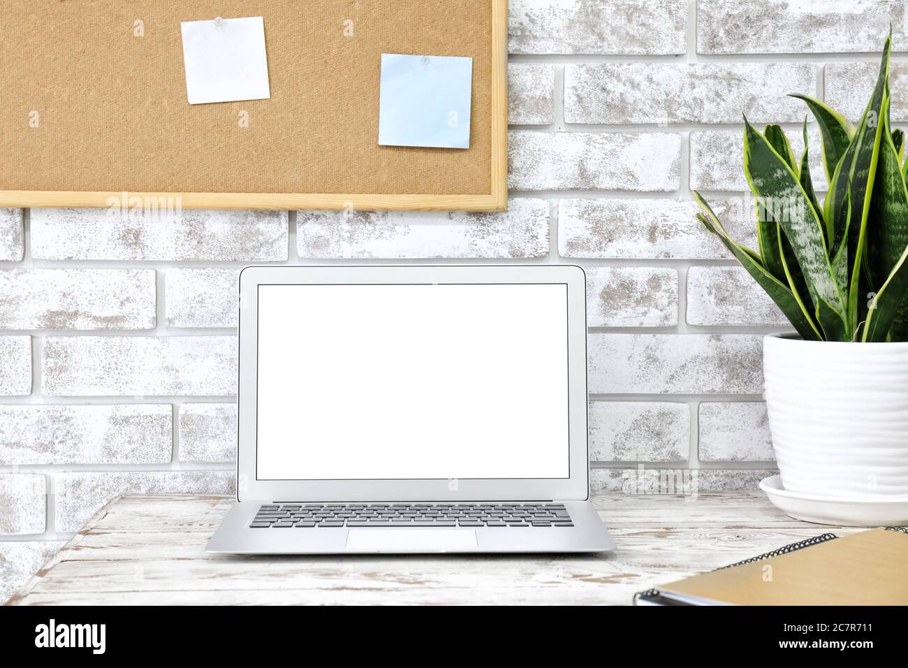 Modern laptop on table in room Stock Photo - Alamy