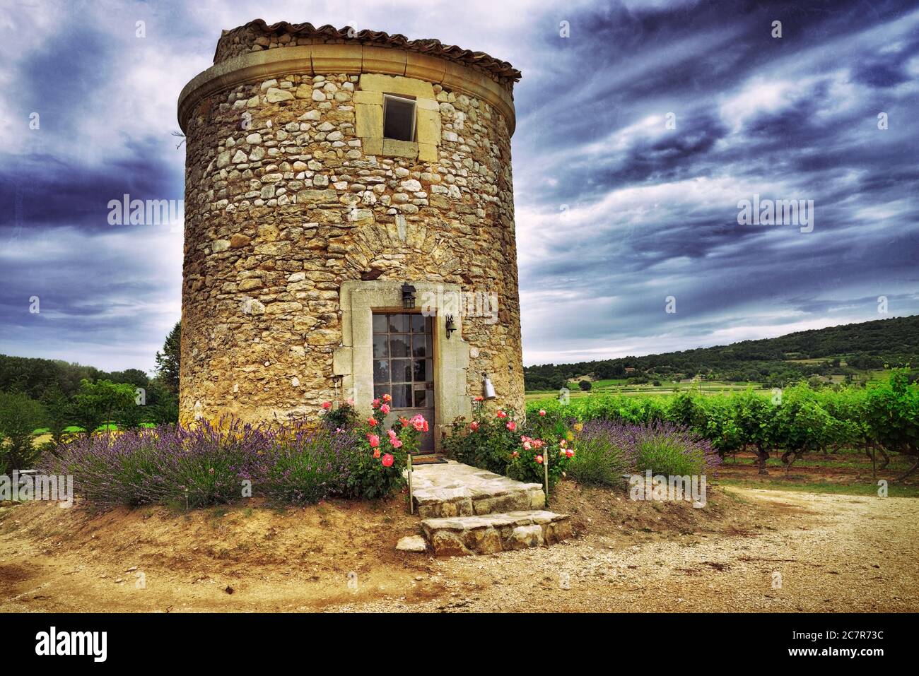 Medieval farmhouse and vineyards in Vaucluse at sunset time, Provence ...