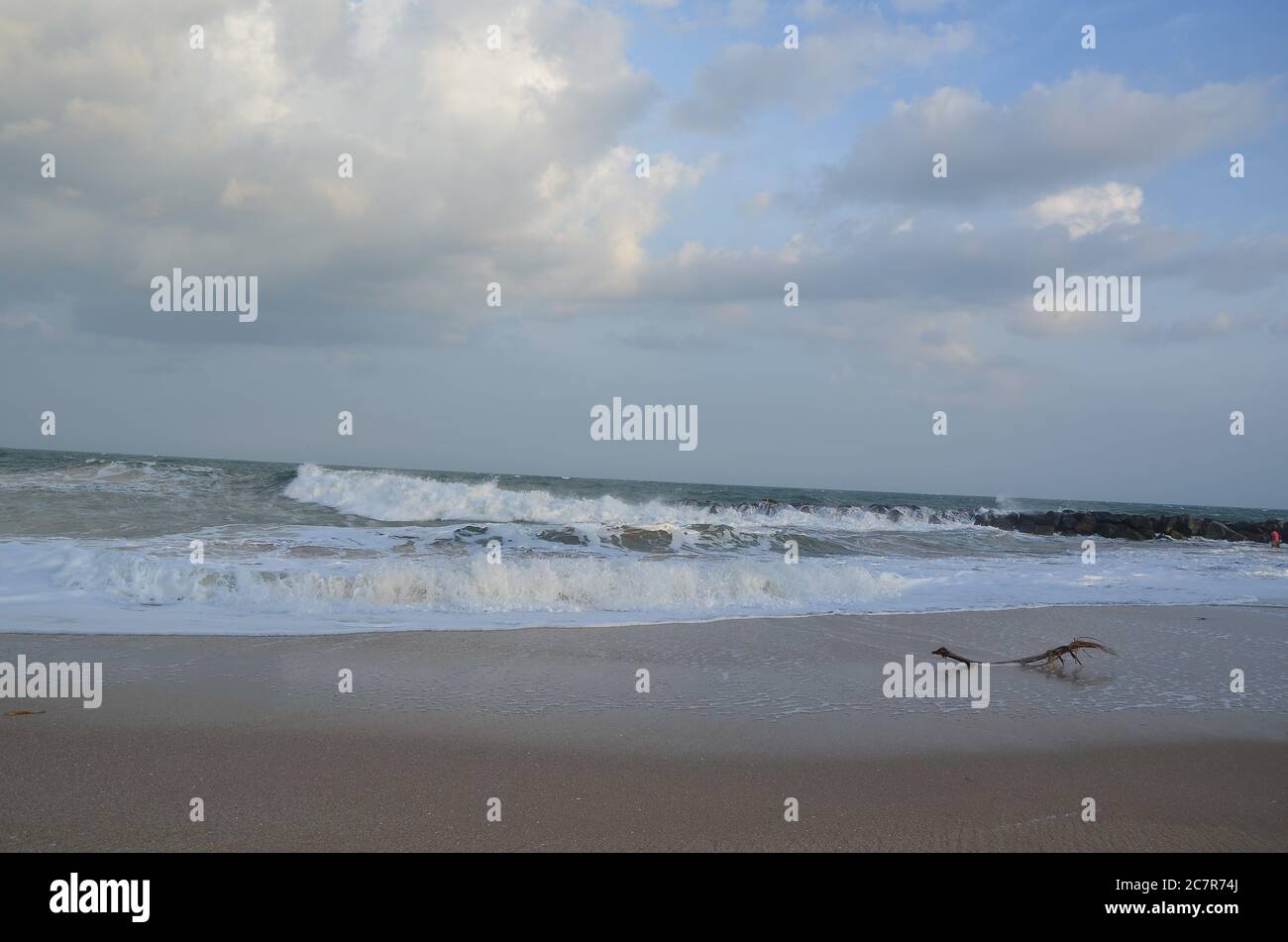 Calm and clean beach captured on a cloudy day Stock Photo - Alamy