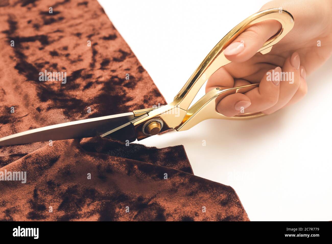 Tailor cutting cloth hi-res stock photography and images - Alamy