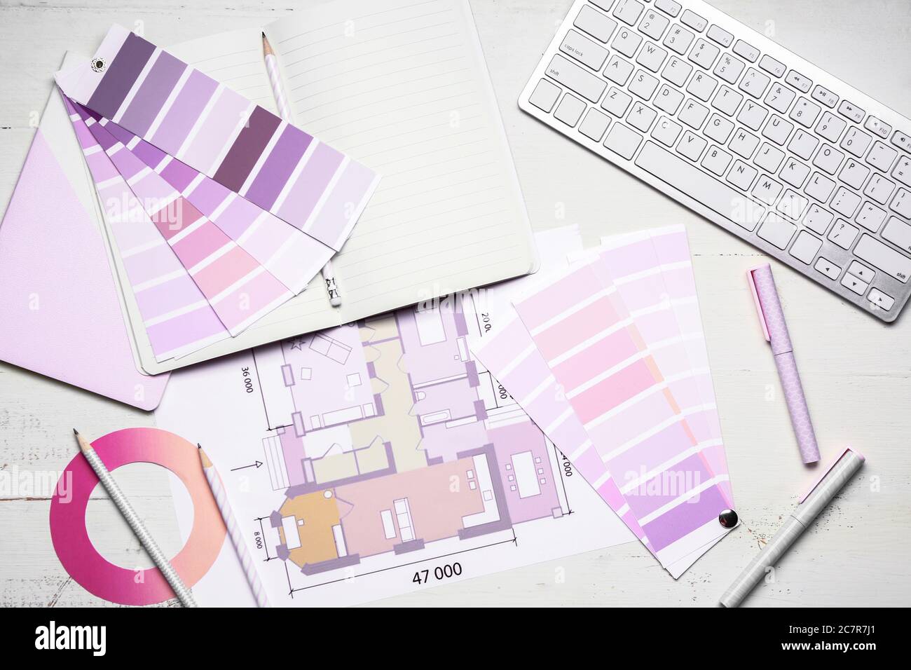 Color palettes with building plan and computer on table Stock Photo - Alamy