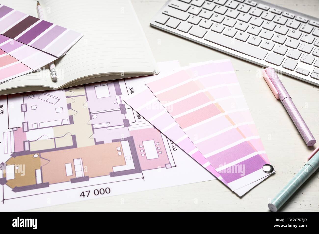Color palettes with building plan and computer on table Stock Photo - Alamy
