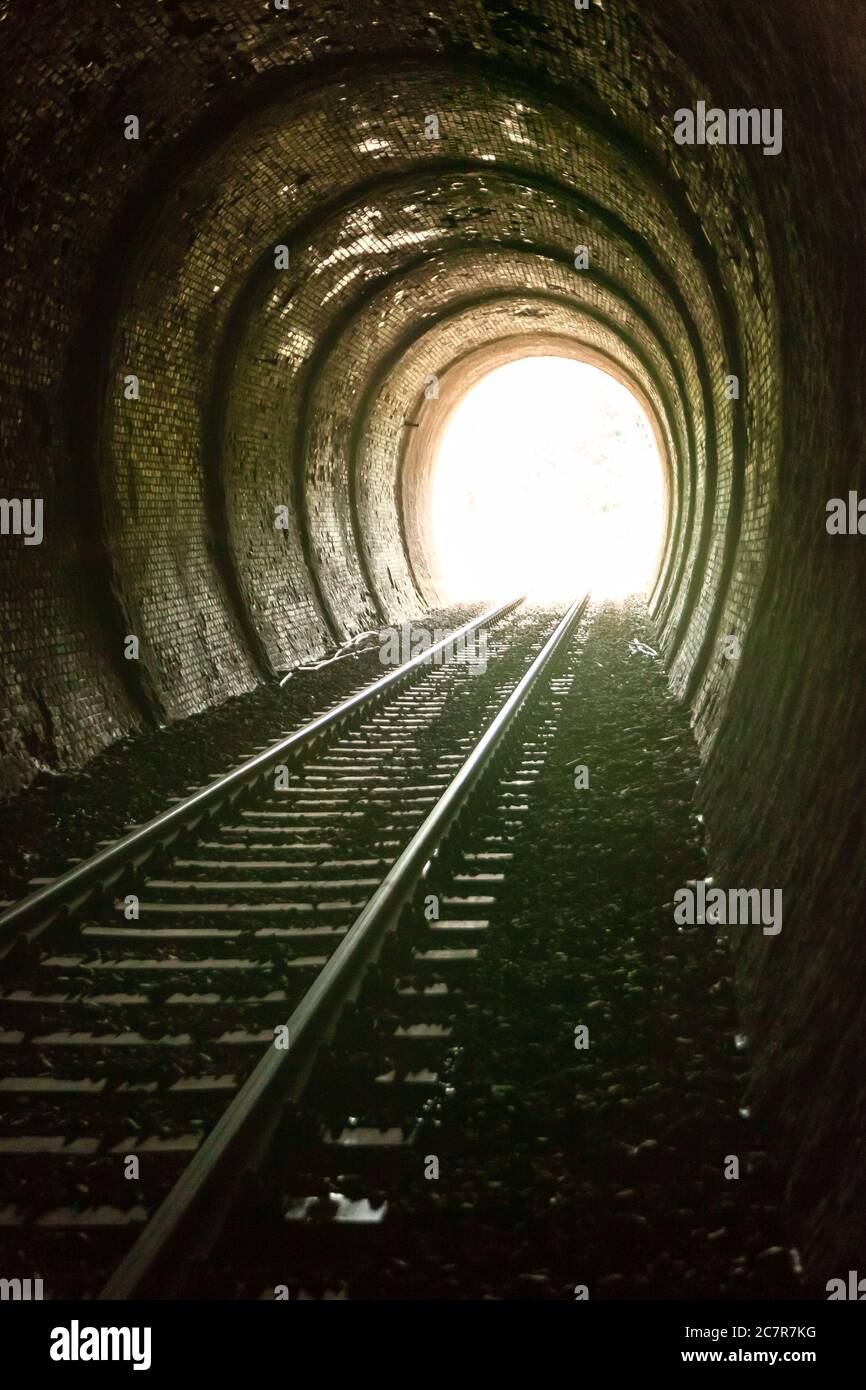 Light at the end of train tunnel Stock Photo - Alamy