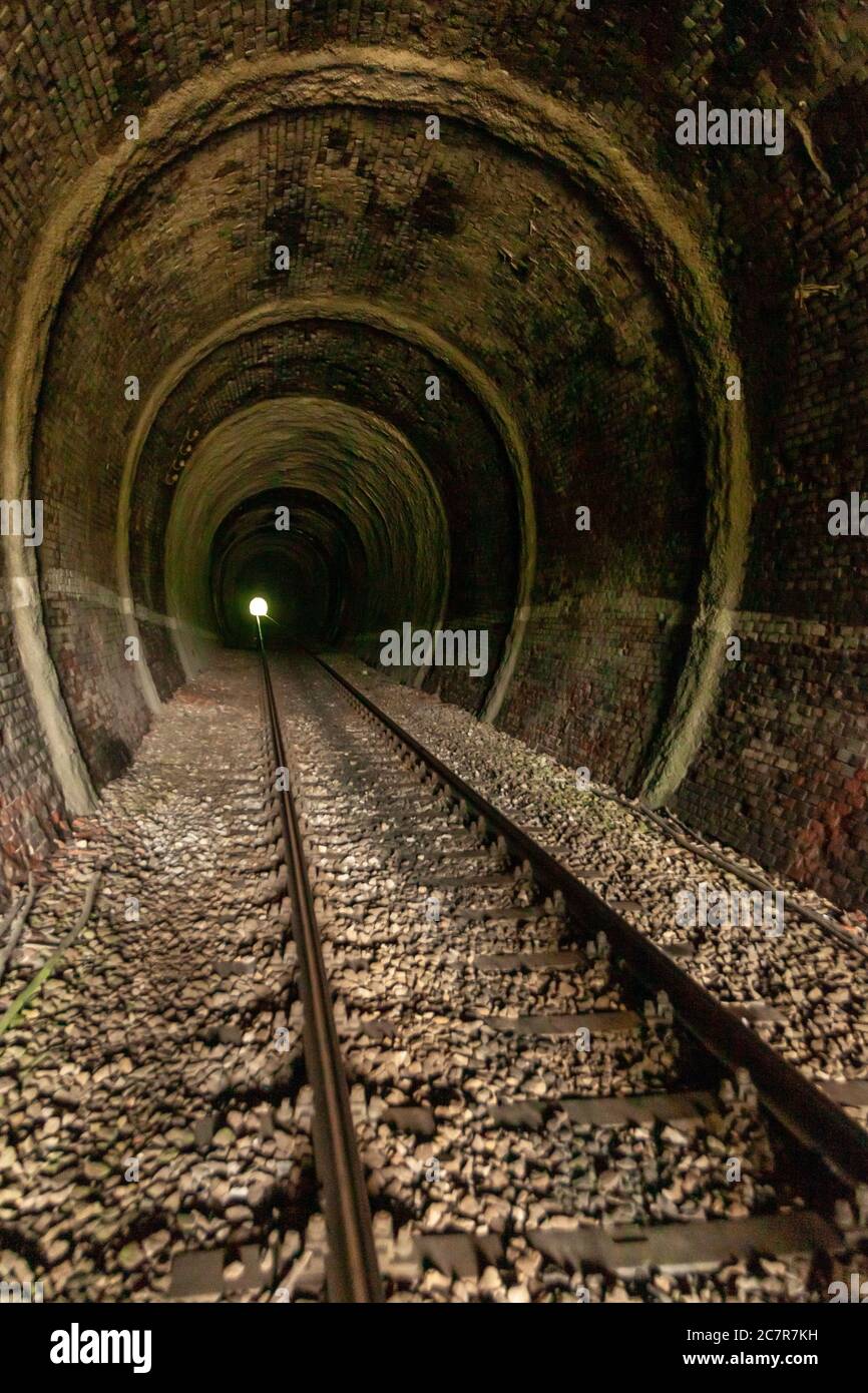 Light at the end of train tunnel Stock Photo - Alamy