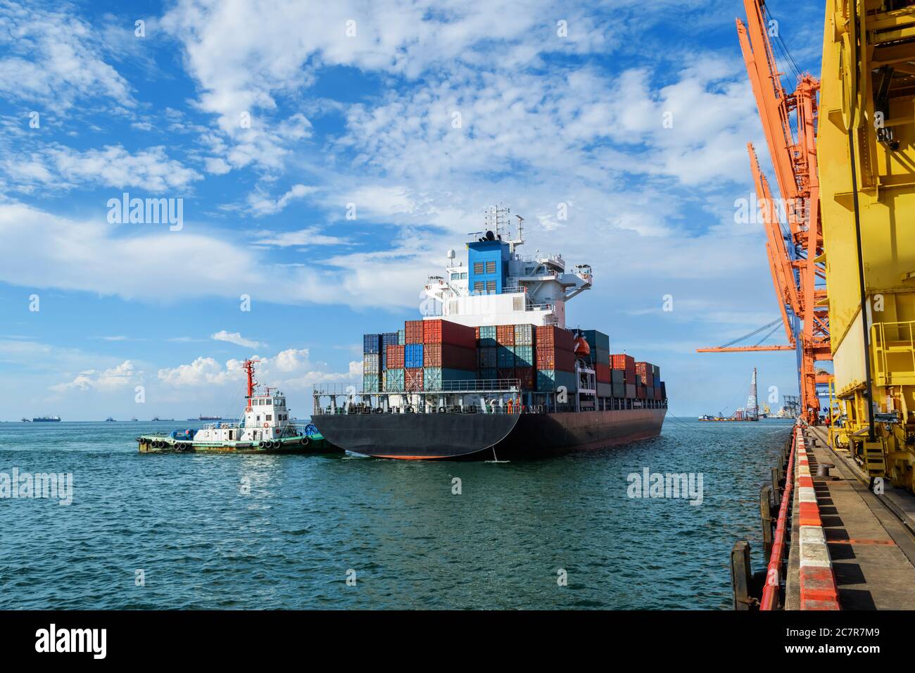Container vessel berthing at an industrial port. Logistics concept ...