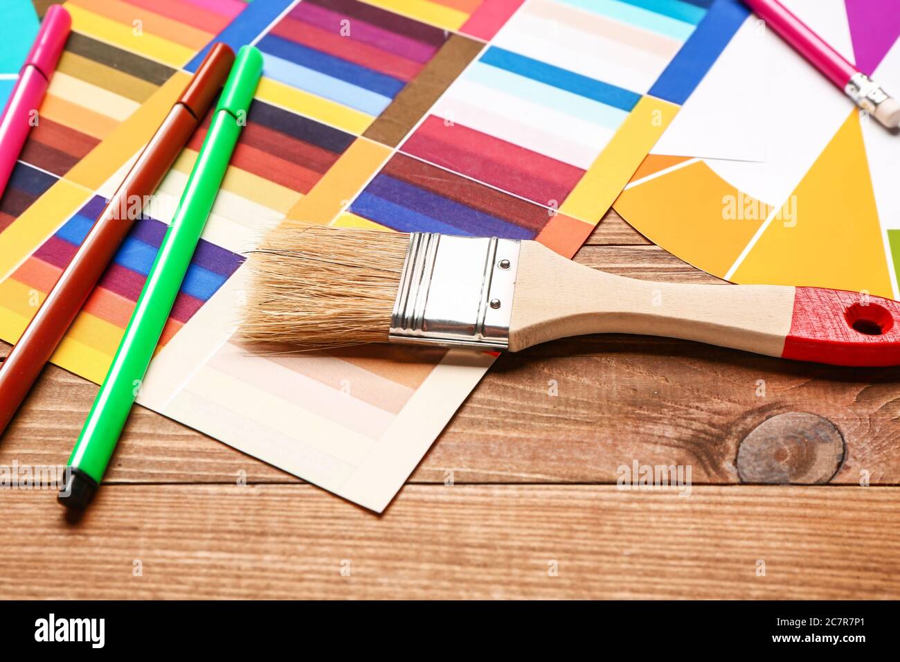 Color palettes with building plan and paint brush on wooden background ...