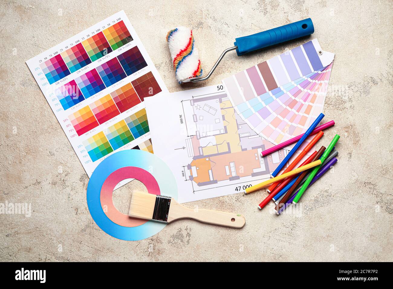 Color palettes with building plan, roller and paint brush on light ...