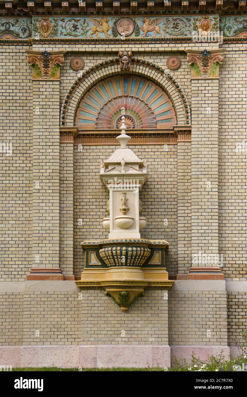 A historic fountain in a historic house wall decoration Stock Photo - Alamy