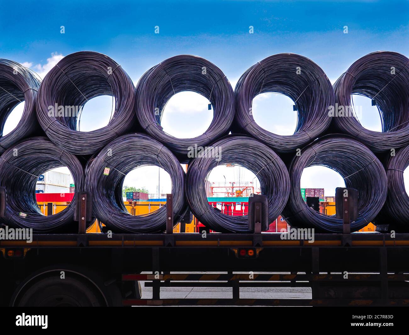 Coils of steel wire rod on truck trailer at industrial zone. Truck ...