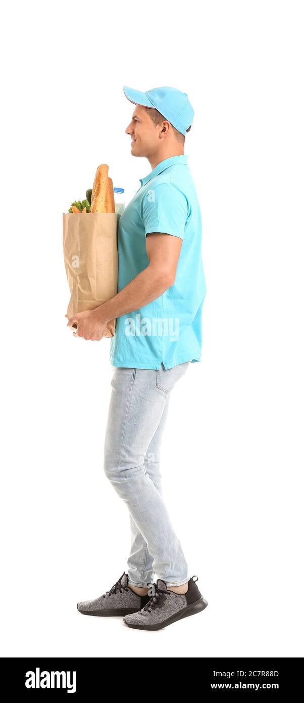 Delivery man with food in bag on white background Stock Photo - Alamy
