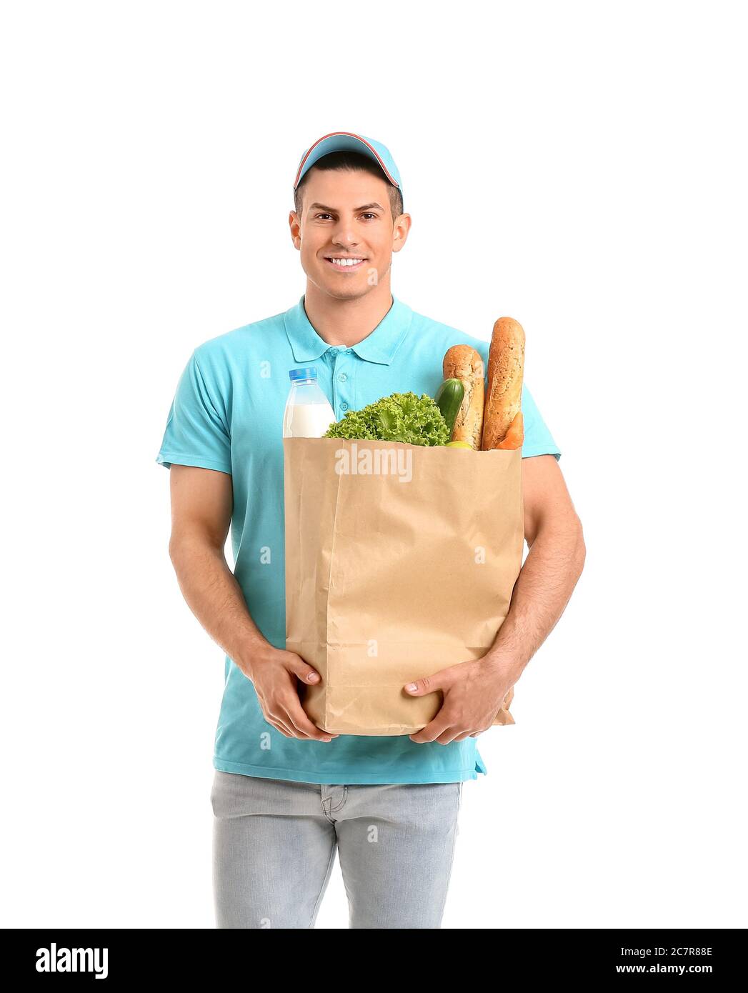Delivery man with food in bag on white background Stock Photo - Alamy