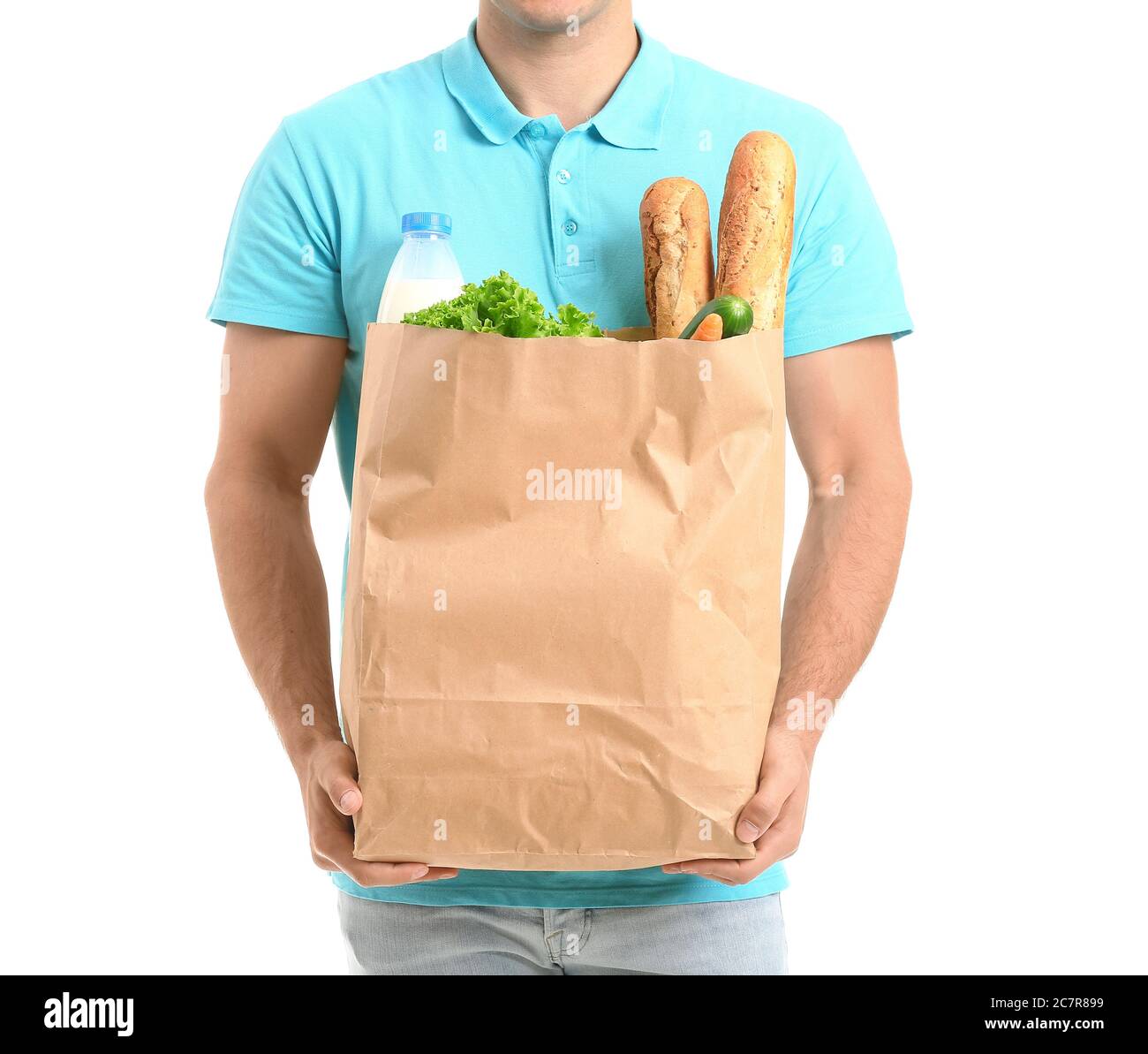 Delivery man with food in bag on white background Stock Photo - Alamy