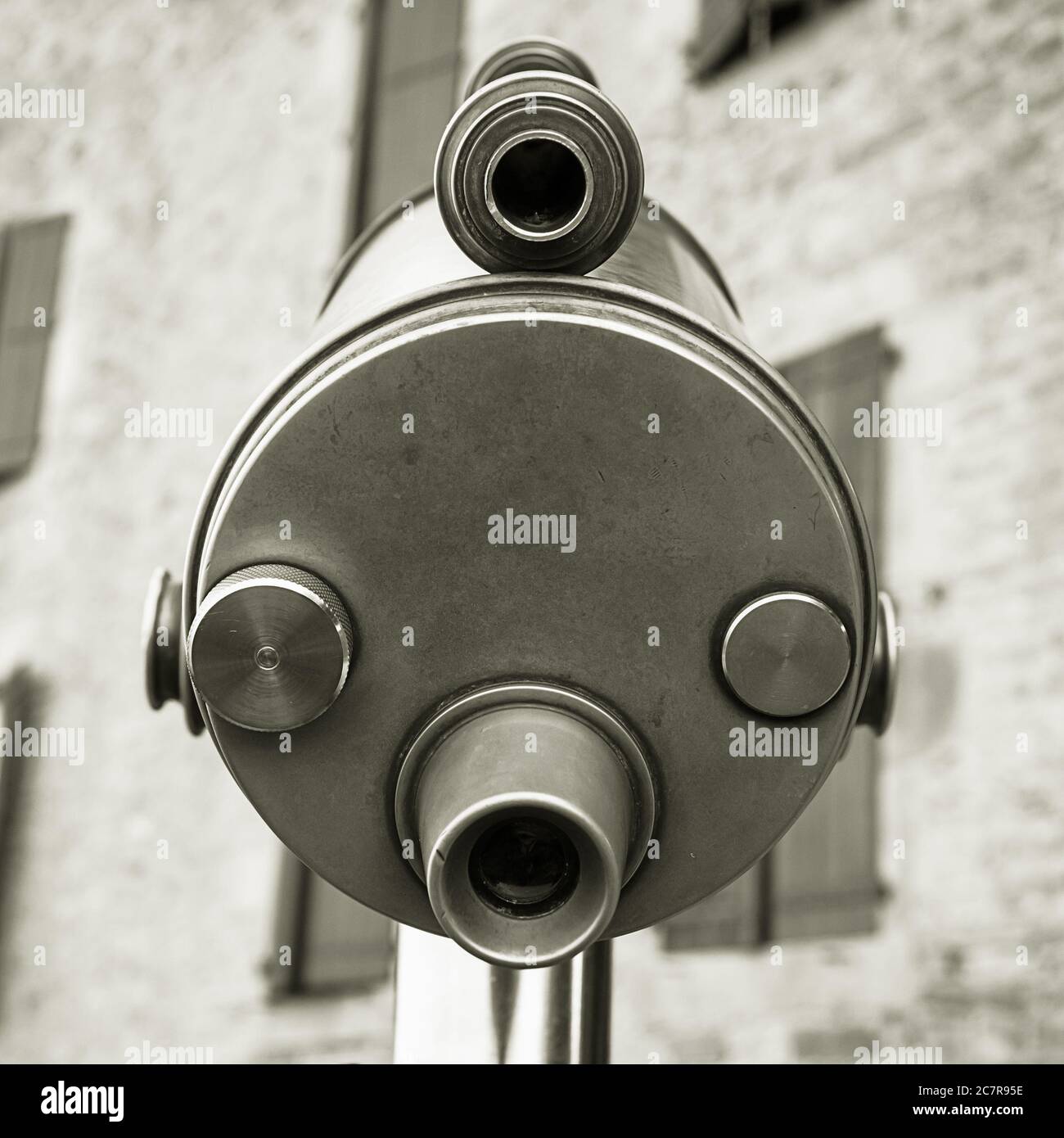 Closeup front view of a gray city telescope on a blurred background ...