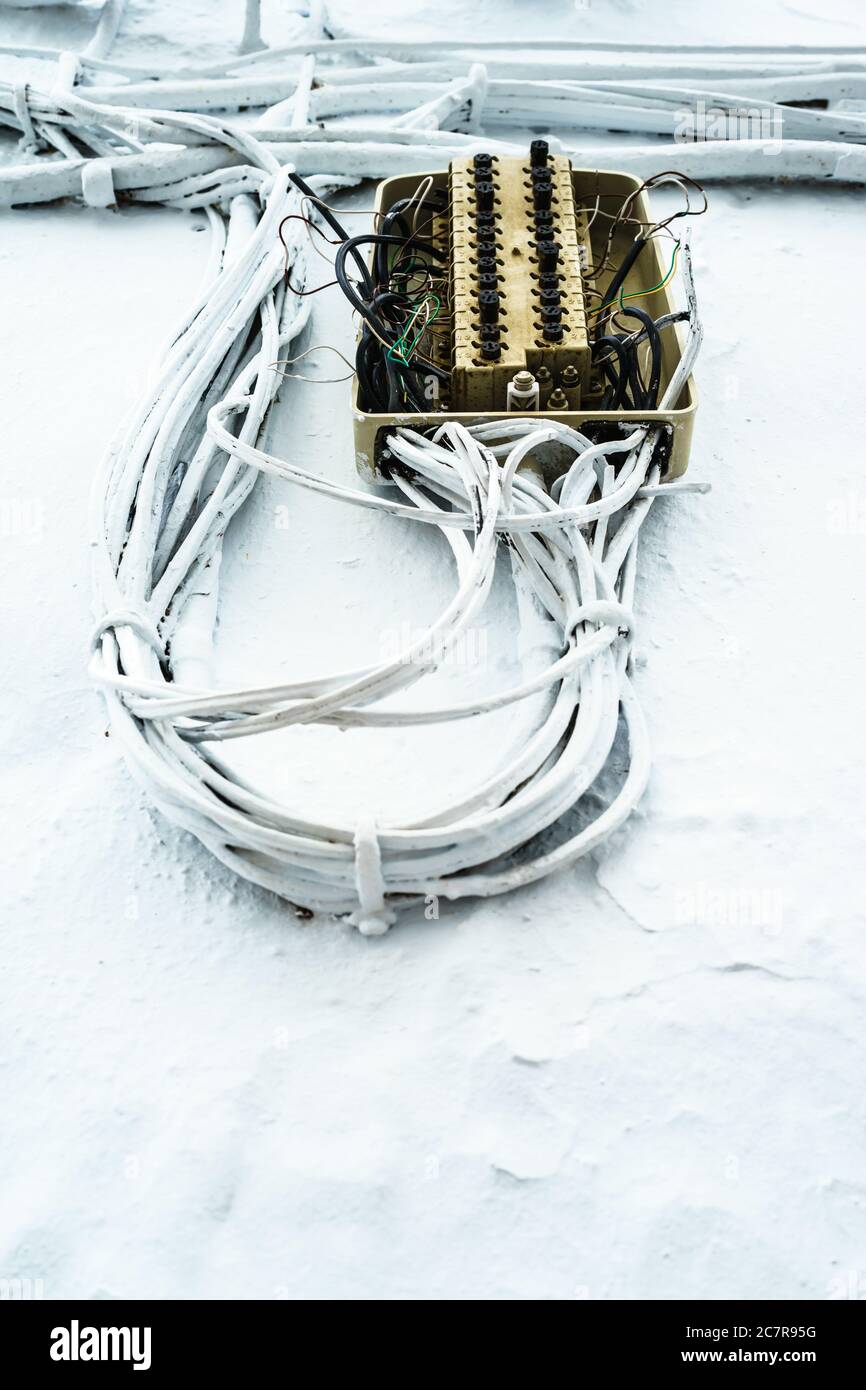 Vertical low angle shot of a colored open electrical box with white ...