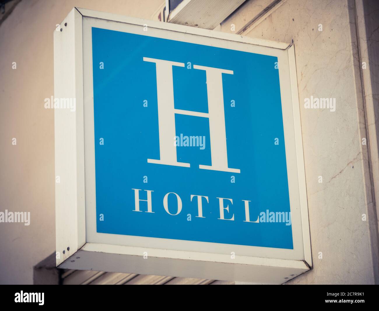 Closeup shot of a square blue sign with a large letter H and the word ...