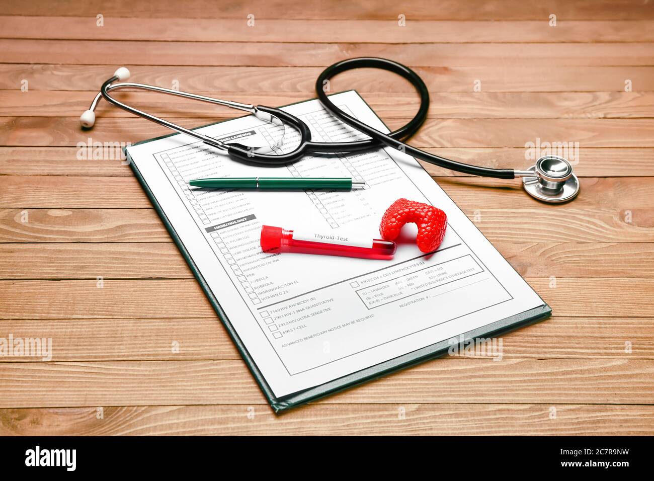 Blood sample in tube with stethoscope, model of thyroid and laboratory ...