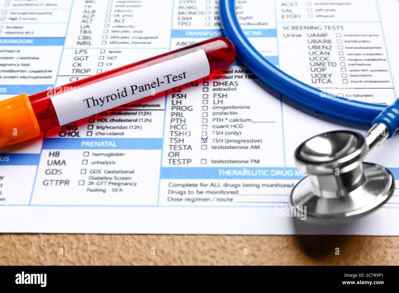 Blood sample in tube with stethoscope and laboratory test form on color ...