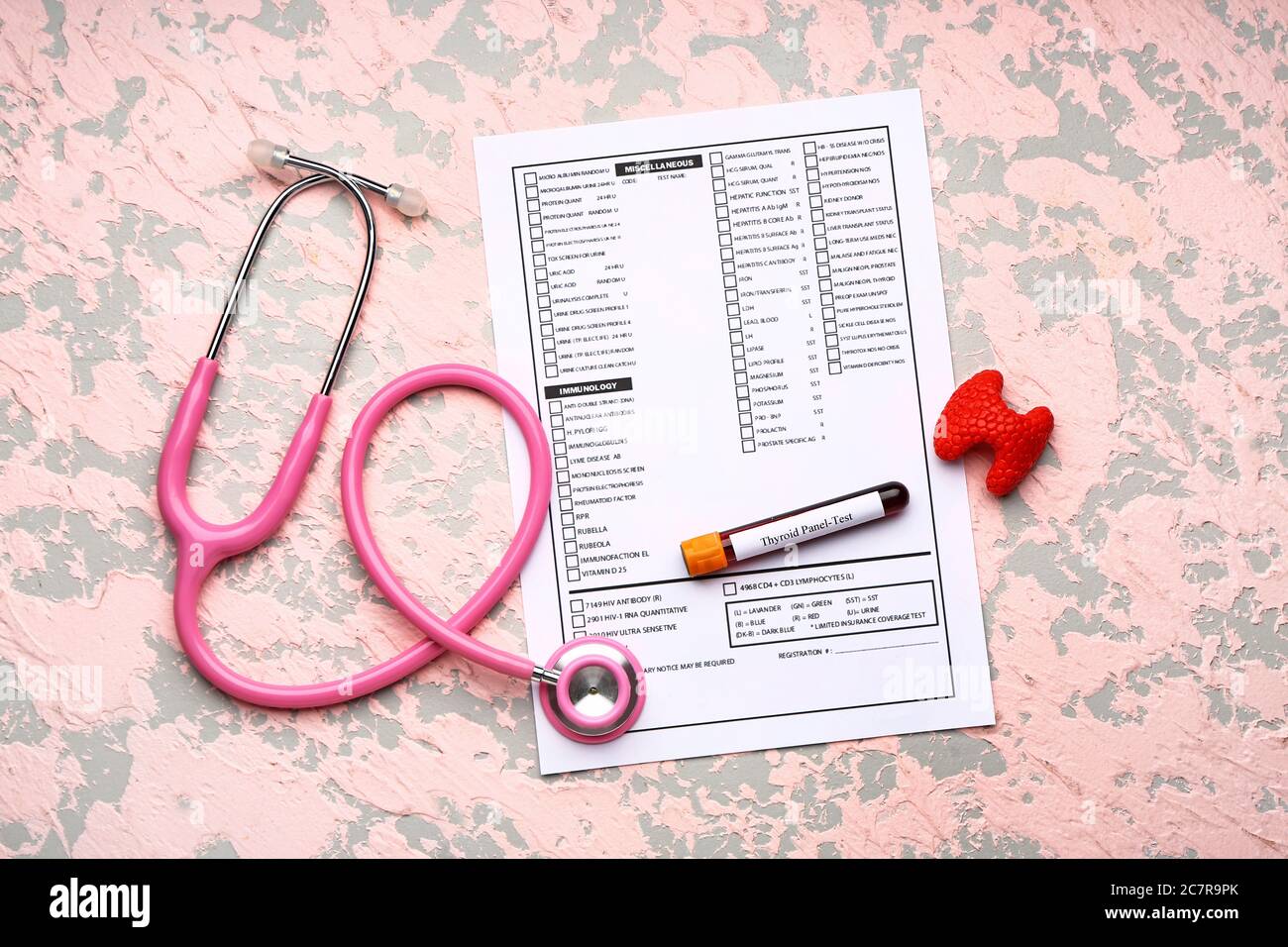 Blood sample in tube with stethoscope, model of thyroid and laboratory ...