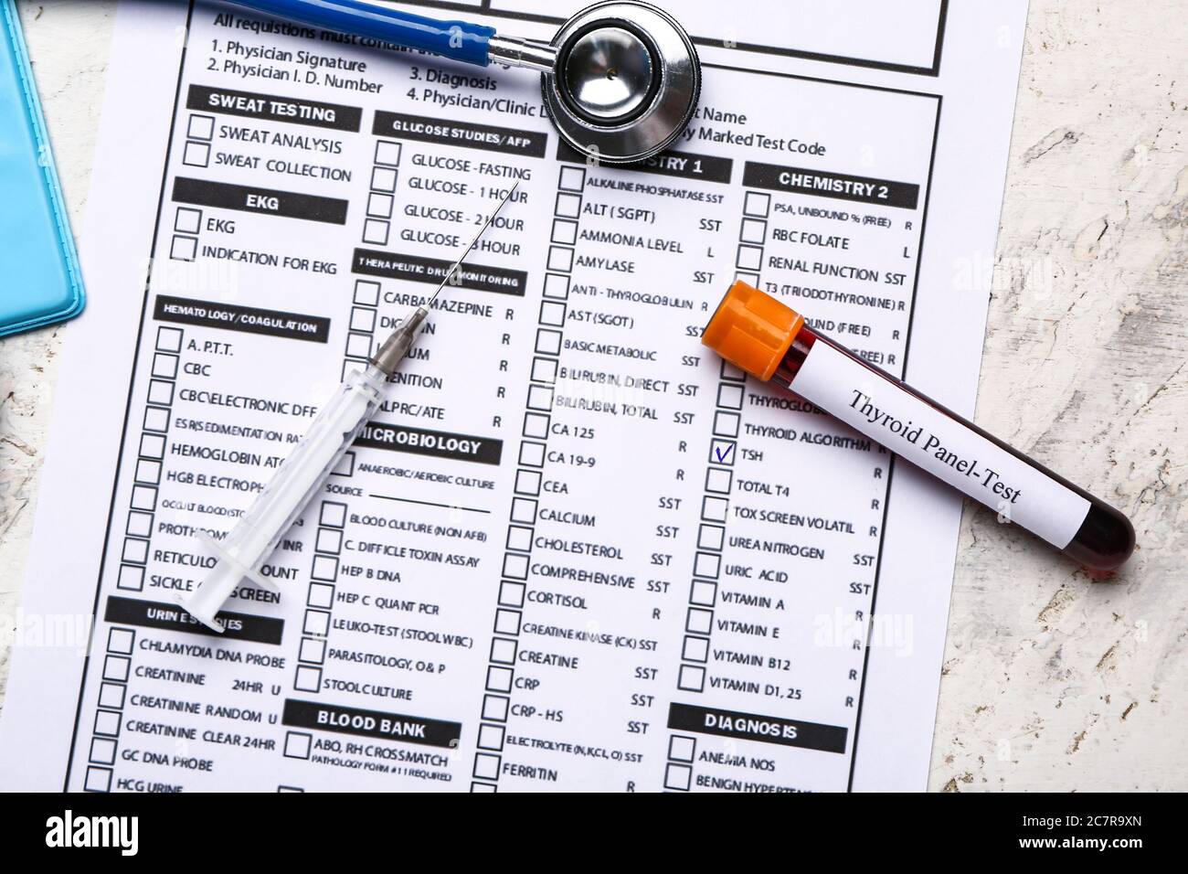 Blood sample in tube with stethoscope, syringe and laboratory test form ...