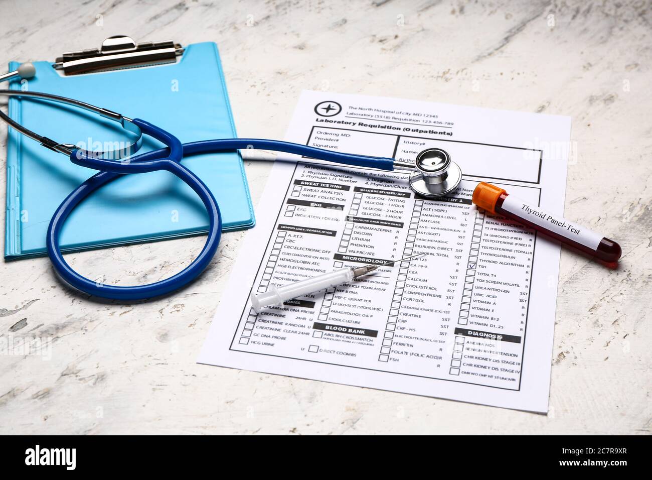 Blood sample in tube with stethoscope, syringe and laboratory test form ...