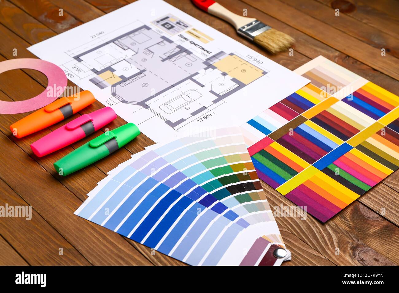 Color palettes with paint brush and building plan on wooden background ...