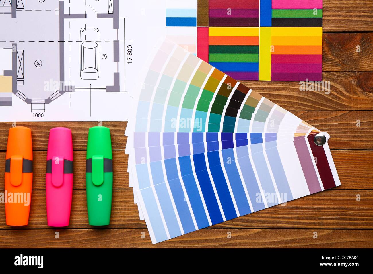 Color palettes with building plan on wooden background Stock Photo - Alamy