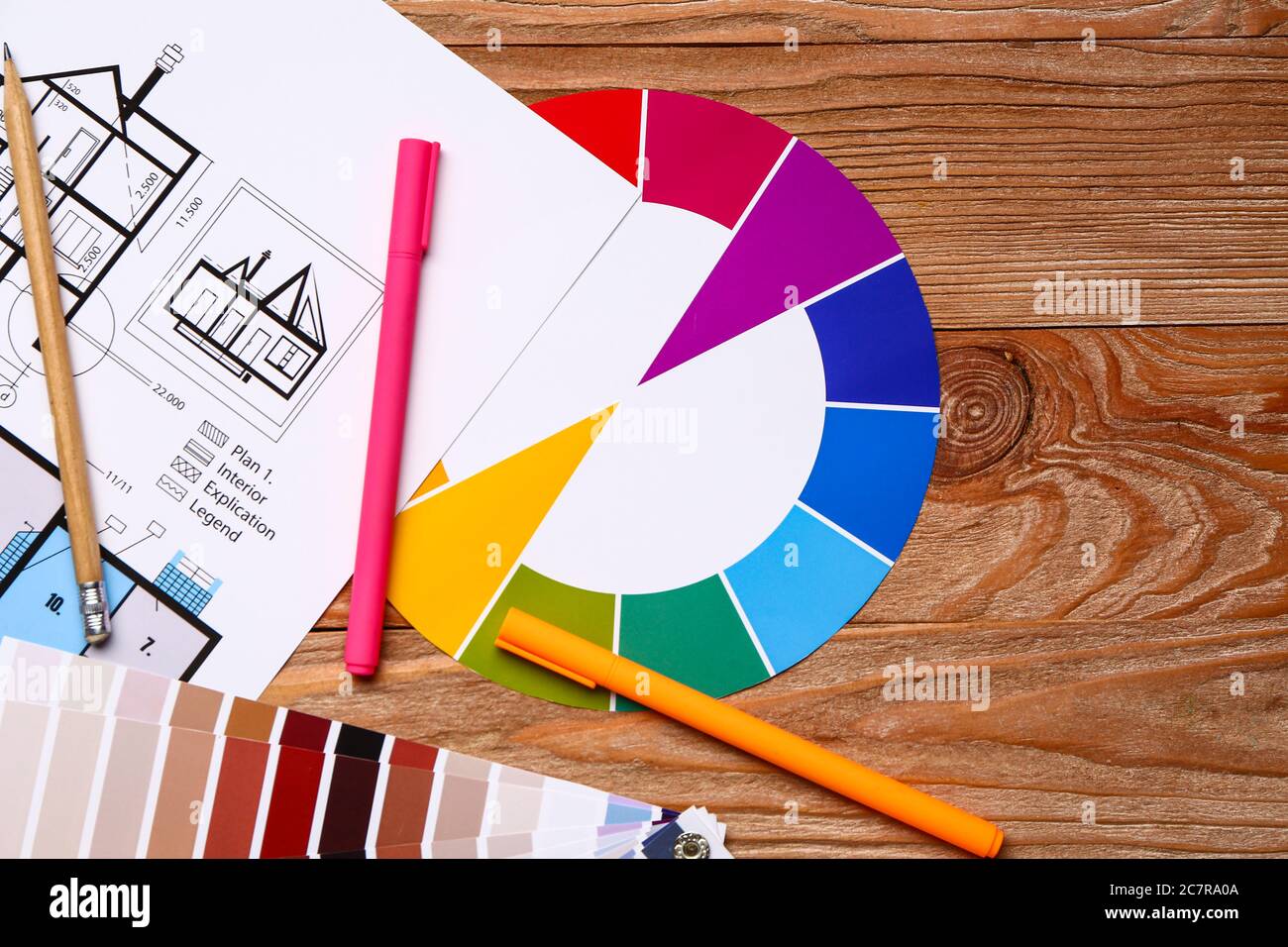 Color palettes with building plan on wooden background Stock Photo - Alamy
