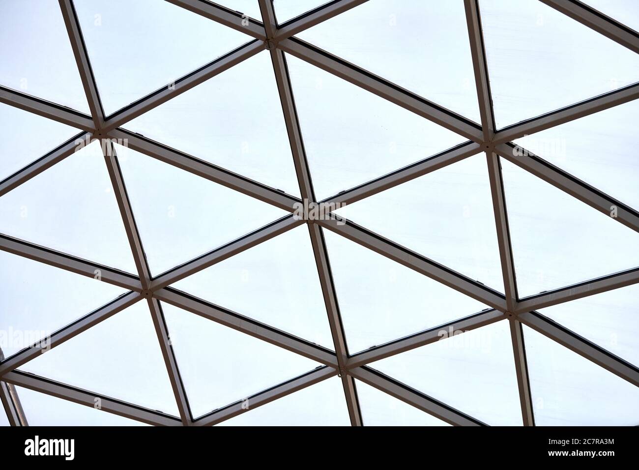 Transparent ceiling in business center. Glass triangle windows. Mesh ...