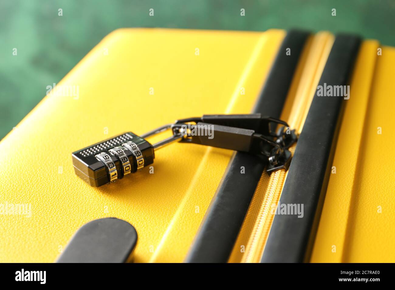 Suitcase with lock on color background, closeup Stock Photo - Alamy