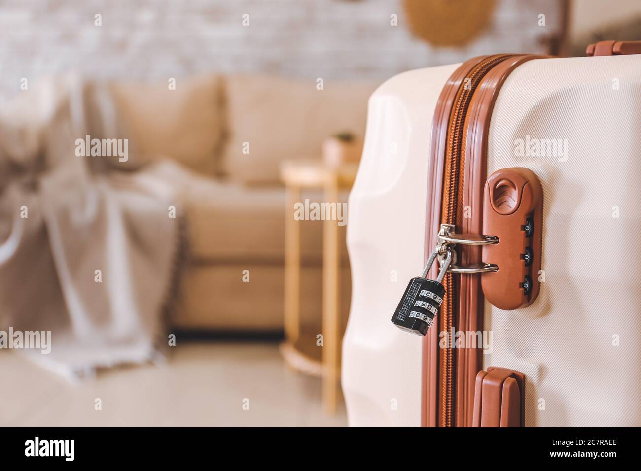 Suitcase with lock in room, closeup Stock Photo - Alamy