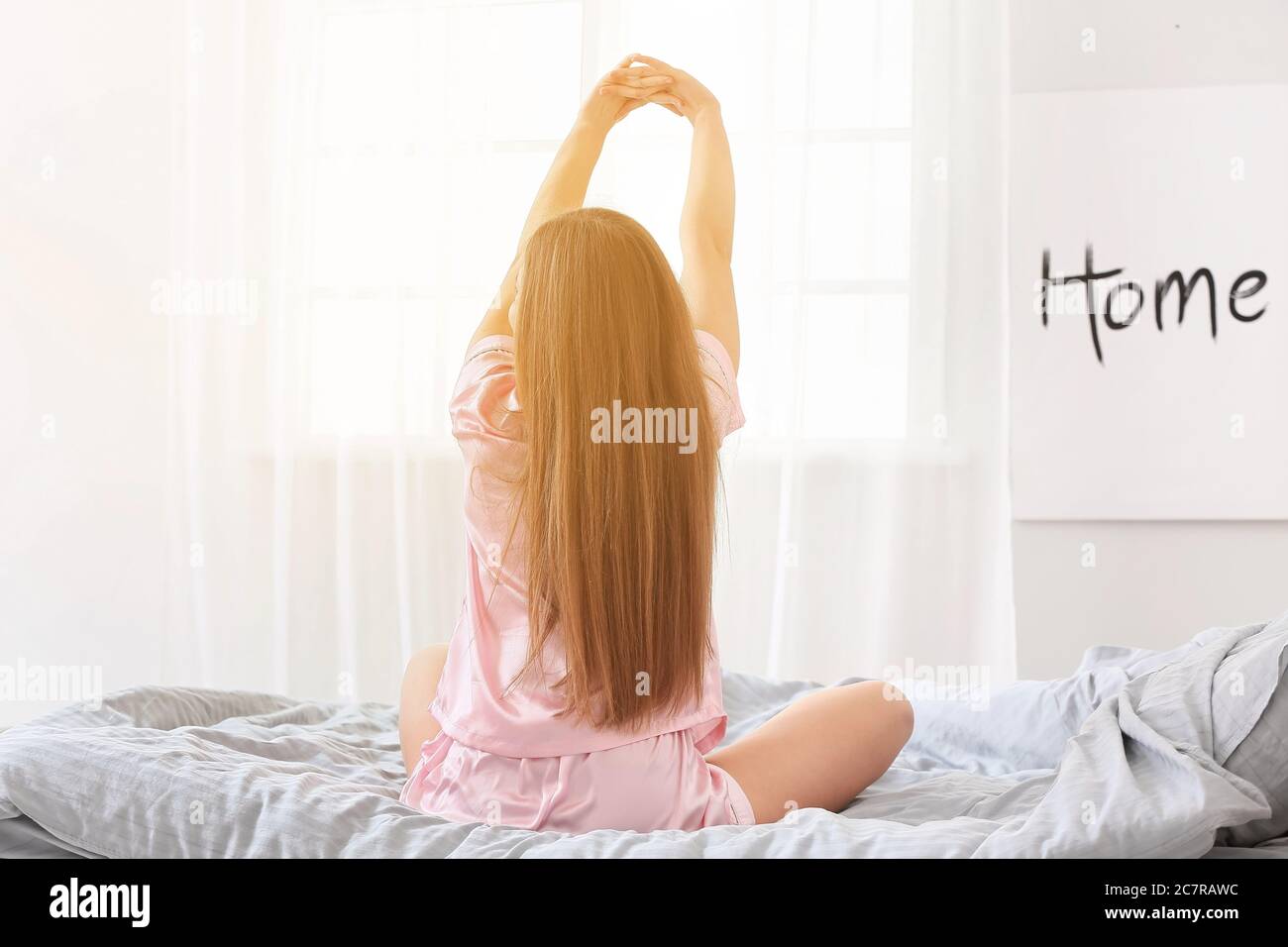 Morning of beautiful young woman in bedroom Stock Photo - Alamy