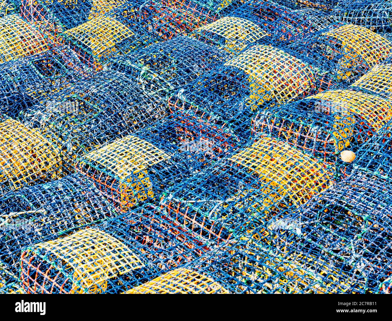 Beautiful shot of colorful blue yellow fish traps in rows Stock Photo ...