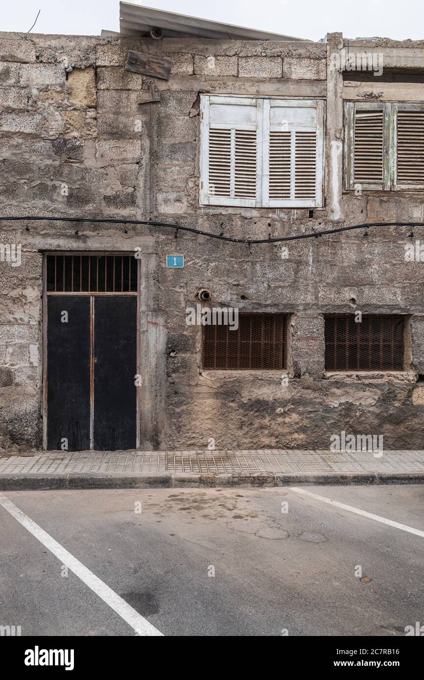 Old derelict building with unrendered walls in Playa San Juan, Tenerife ...