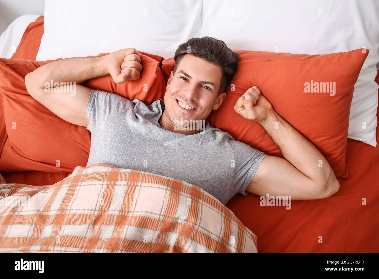Morning of young man in bed Stock Photo - Alamy