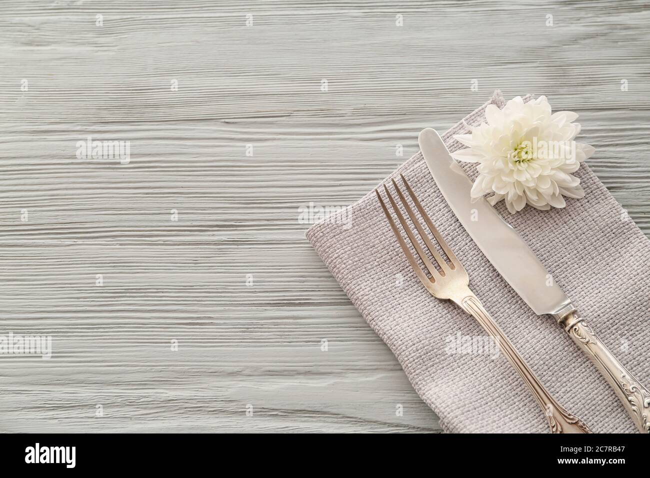 Simple table setting on wooden background Stock Photo - Alamy
