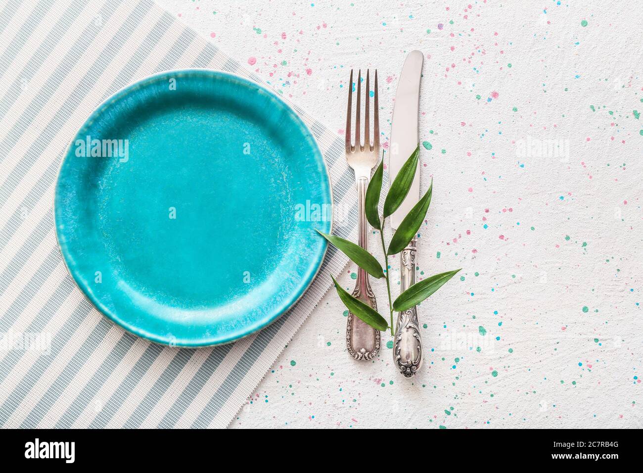 Simple table setting on white background Stock Photo - Alamy