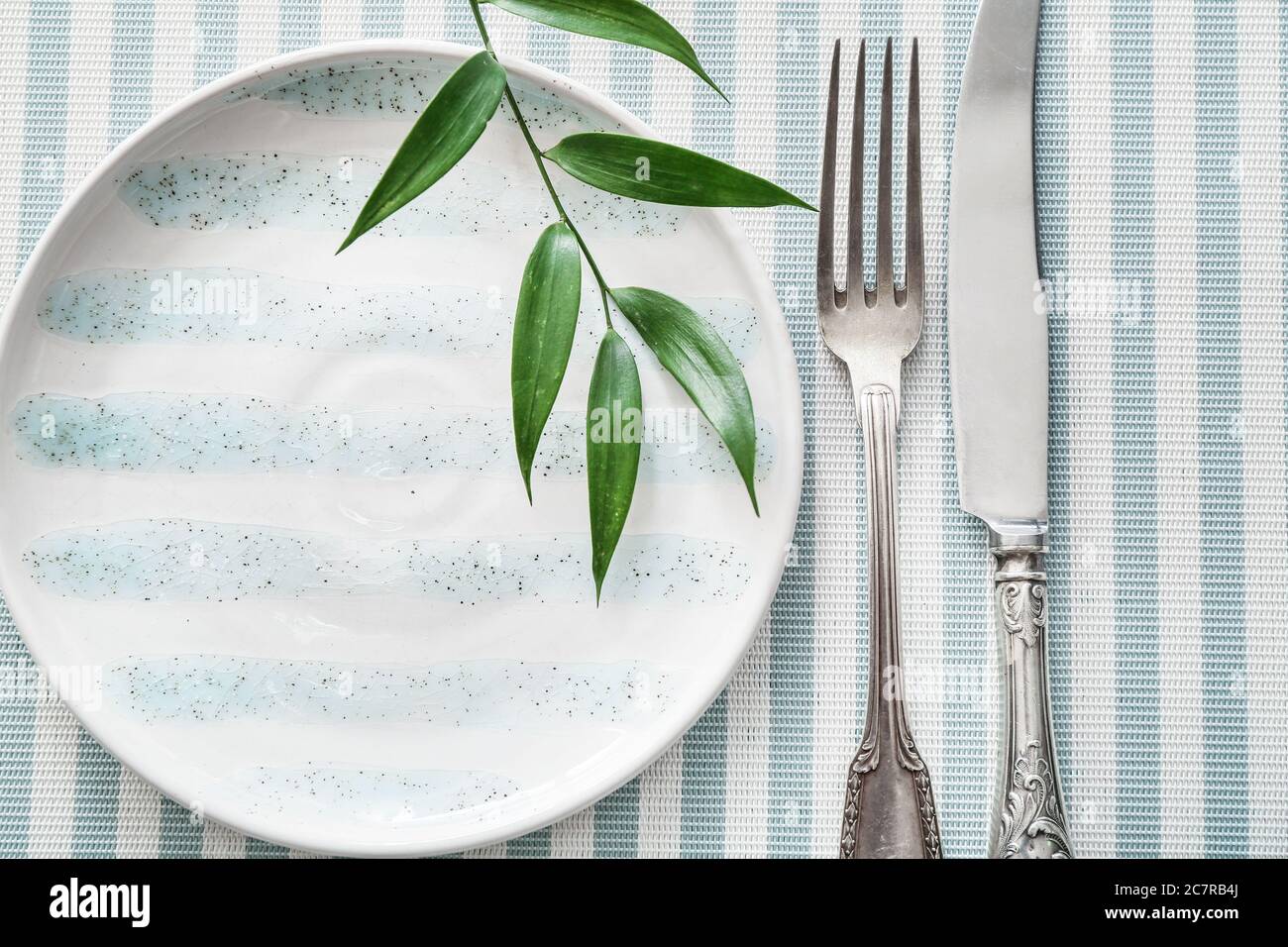 Simple table setting in restaurant Stock Photo - Alamy