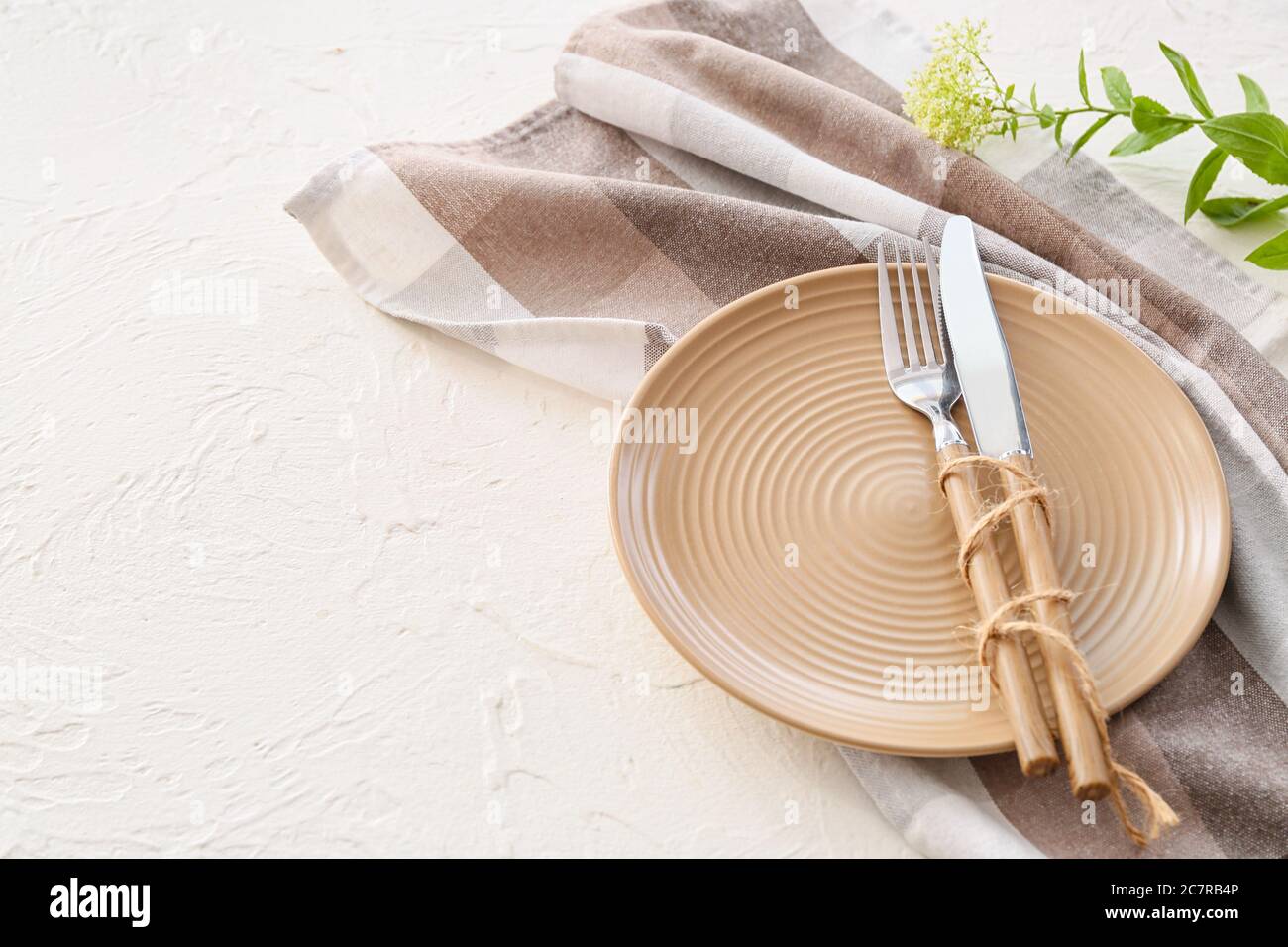 Simple table setting on white background Stock Photo - Alamy