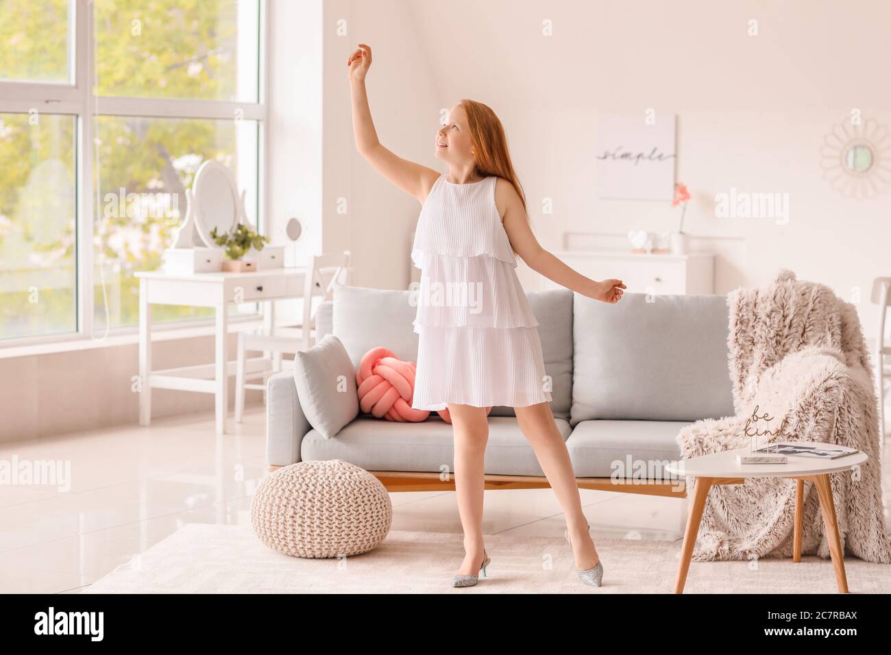Cute redhead girl dancing at home Stock Photo - Alamy