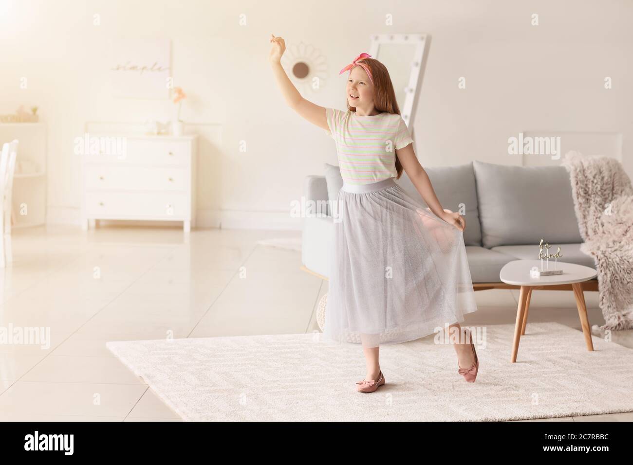 Cute redhead girl dancing at home Stock Photo - Alamy